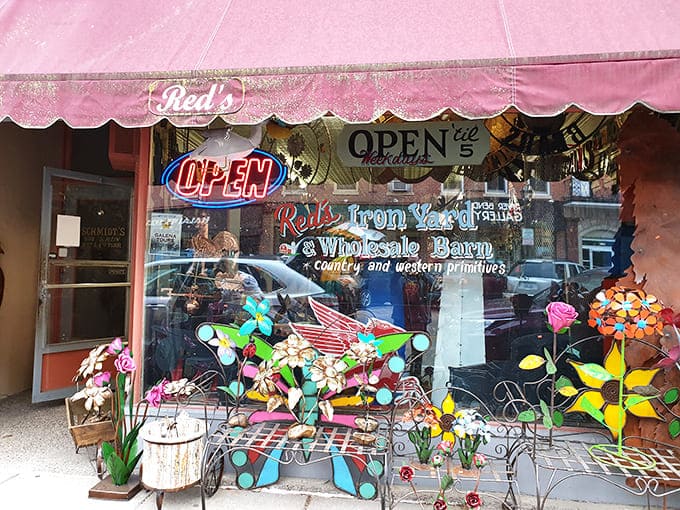 Red's Iron Yard proves that storefronts can have personality, especially when decorated with enough metal flowers to make a robot garden jealous.