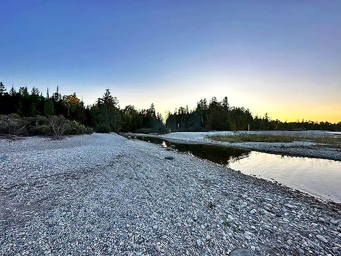 Nature's rocky welcome mat stretches along the shore, each stone a chapter in Great Lakes history waiting to be discovered.