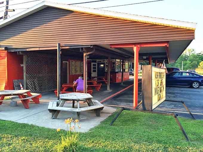 Rustic picnic tables offer the perfect perch for people-watching while savoring comfort food classics &ndash; simple pleasures at their finest.