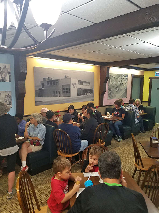 Inside Sherman's, vintage photos and cozy booths create a time capsule where families gather to enjoy frozen perfection in a nostalgic setting.