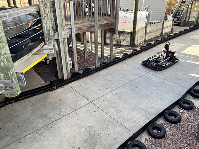 Solo racers grip steering wheels with white-knuckle determination, channeling their inner NASCAR champions on The Track's winding course.