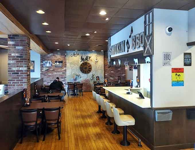 Inside Smokin' Notes, the warm wood and brick interior creates the perfect backdrop for the smoky symphony about to unfold.