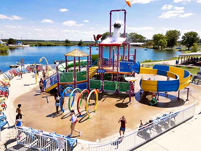 Rainbow-colored splash rings create a water wonderland where kids dodge, dash, and delight in getting thoroughly soaked from every possible angle.