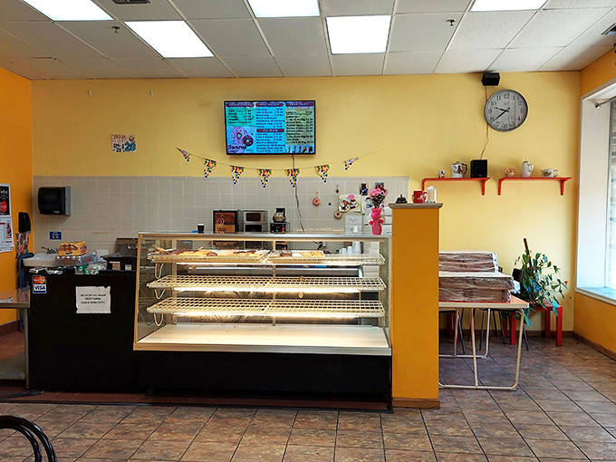 Cheerful yellow walls welcome visitors into a no-frills space where the focus remains squarely where it belongs&mdash;on exceptional donuts.