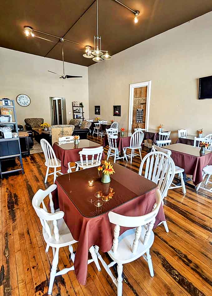 Inside, burgundy tablecloths and white wooden chairs create a homey atmosphere where time slows down and conversations flow as freely as the coffee.