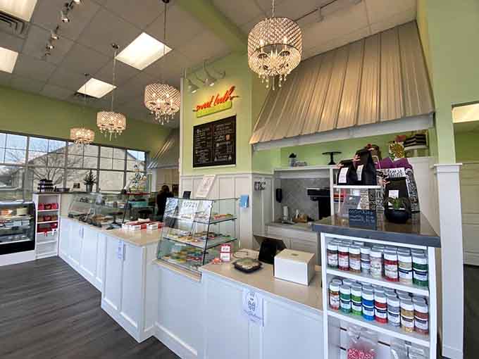 Step inside to discover a bright, inviting space where sparkling chandeliers illuminate cases filled with irresistible treats.