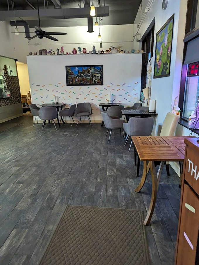 Modern comfort meets donut shop charm in this inviting interior. The sprinkle-decorated walls hint at the sweet treasures ahead.