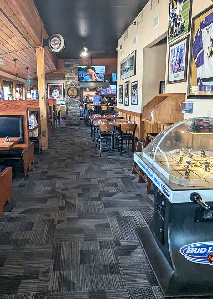 Wood, stone, and foosball create the perfect trifecta for a neighborhood hangout that knows its audience.