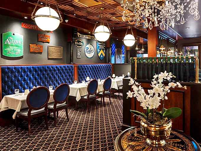 Royal blue tufted booths and warm lighting create an atmosphere where memories are made, one perfect bite at a time.