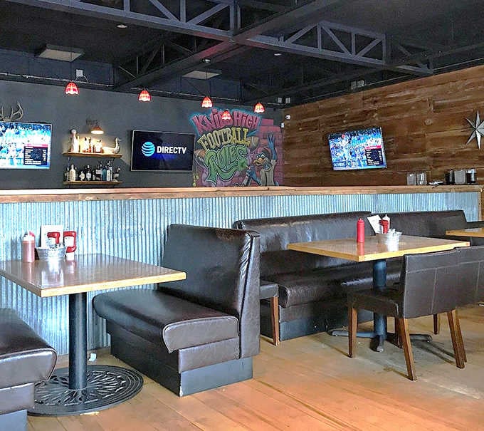 Industrial-chic meets cozy comfort in this thoughtfully designed space where corrugated metal and warm wood create barbecue's perfect backdrop.