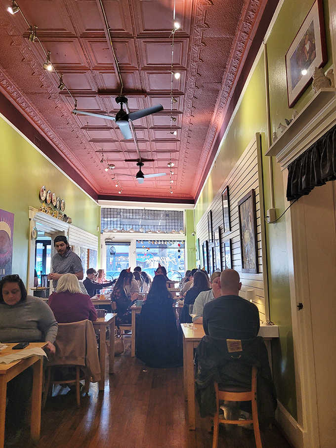 Lime green walls meet a stunning pink tin ceiling in this bustling tearoom where conversations flow as freely as the tea.