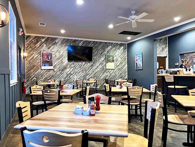 Modern comfort meets small-town warmth in this thoughtfully designed space where the diagonal wood accent wall steals the show.