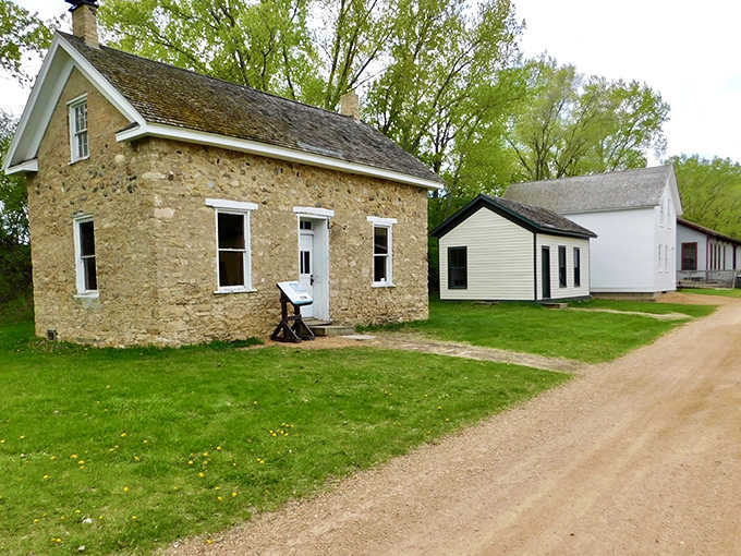 A yellow farmhouse and red barn stand as sentinels of simpler times, when neighbors knew each other's horses by name.