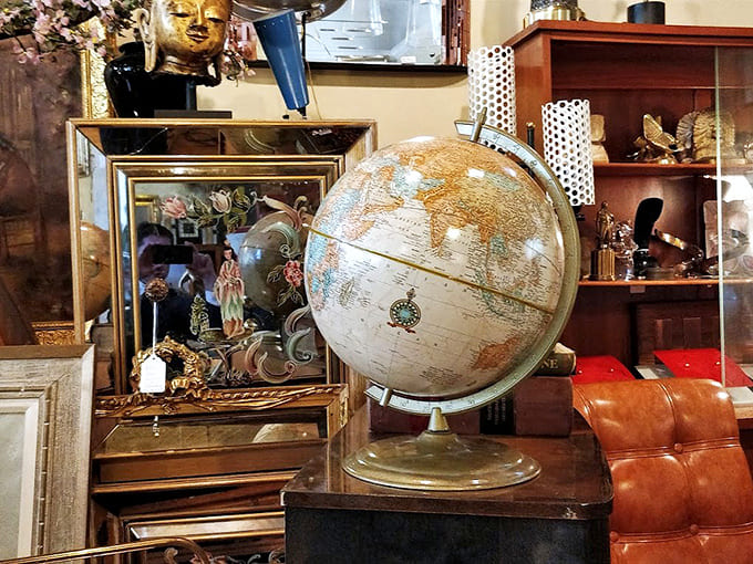 Vintage globes and golden Buddha heads create an eclectic display that would make Indiana Jones jealous of your shopping trip.