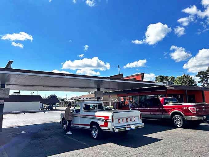 Cars line up in the parking area, a daily pilgrimage of locals and visitors seeking that perfect combination of chili dogs and frosty root beer.