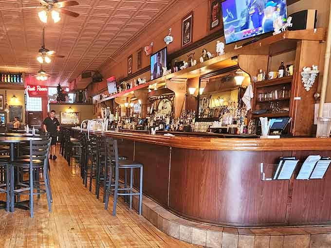 That gorgeous wooden bar stretches invitingly, promising cold craft beers and conversations that last longer than you planned.