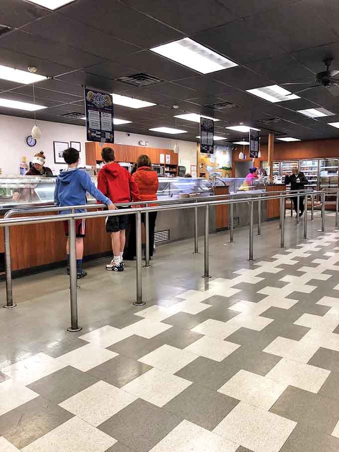 The classic interior layout features gleaming counters and that unmistakable ice cream parlor atmosphere where happiness is served by the scoop.