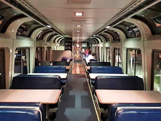 Inside, the train offers comfortable seating where the biggest decision you'll make is window or aisle. Choose window. Always window.