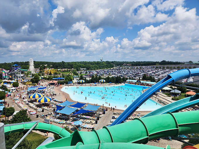 From this bird's-eye view, the massive wave pool resembles a blue oasis surrounded by a sea of sunbathers seeking their perfect spot.