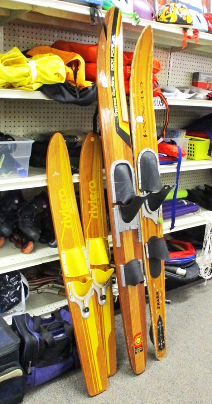 Vintage wooden water skis stand at attention, whispering tales of summers past and lake adventures yet to come.