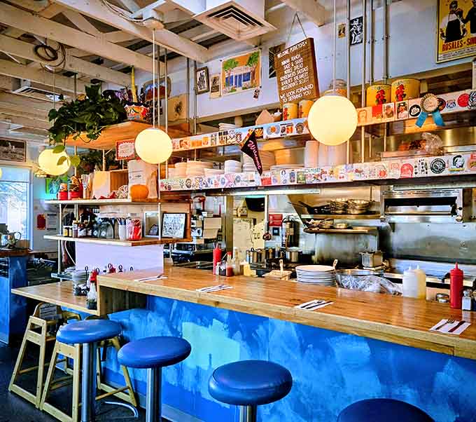Blue booths and vintage vibes create the perfect backdrop for your Jackfruit Po'Boy adventure at Welcome Diner.