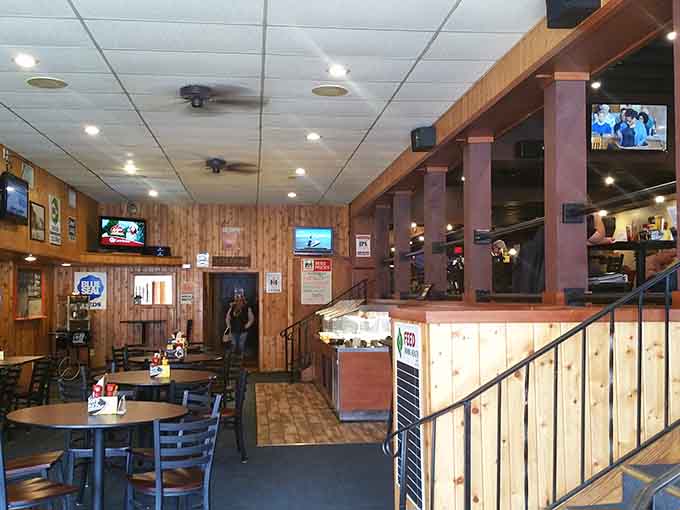 Wood paneling and TVs create that perfect neighborhood spot vibe where everyone feels like a regular, even on their first visit.