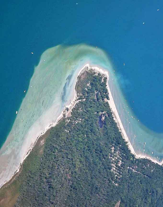 From above, the peninsula looks like a giant finger pointing toward paradise, surrounded by waters so blue they seem Photoshopped.
