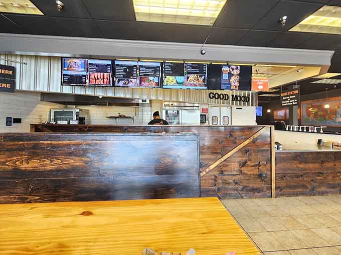 Inside, rustic wood meets modern comfort where the sauce station beckons like a barbecue lover's candy store.