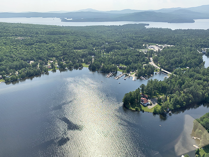 From above, Rangeley's waterways glisten like scattered sapphires, each cove and inlet telling its own story of Maine's natural splendor.