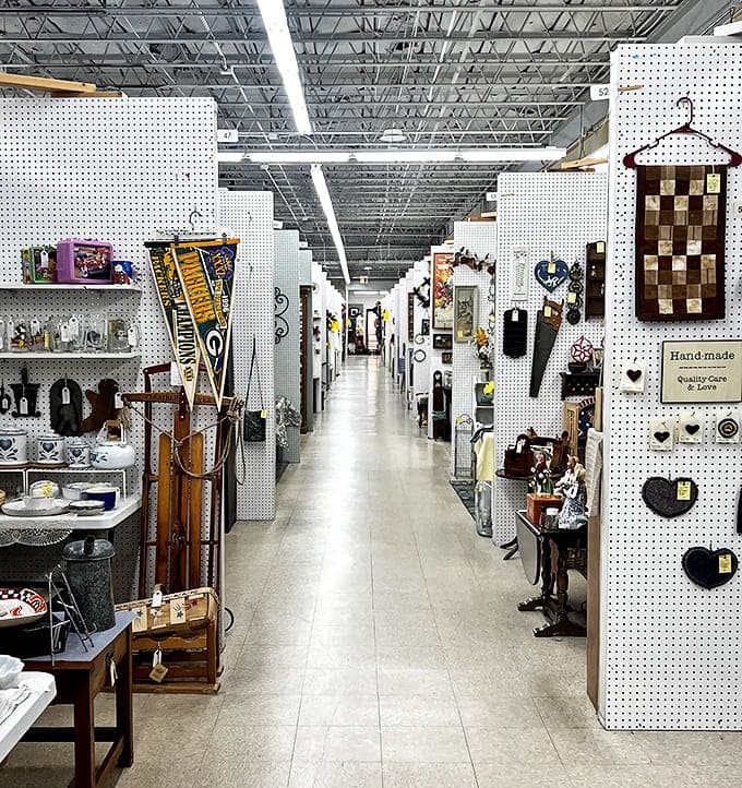 Long, pristine aisles stretch like memory lanes, white pegboard walls creating the perfect canvas for decades of American life on display.