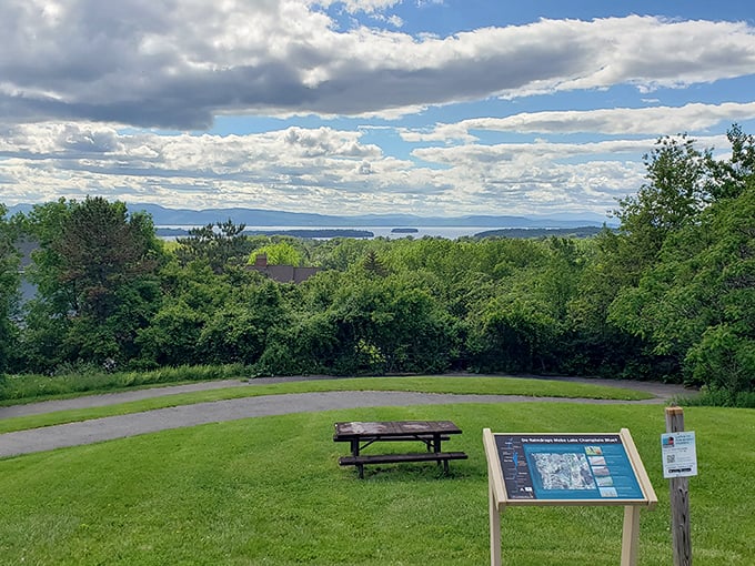 A solitary bench invites contemplation with Lake Champlain and the Adirondacks providing nature's version of therapy.