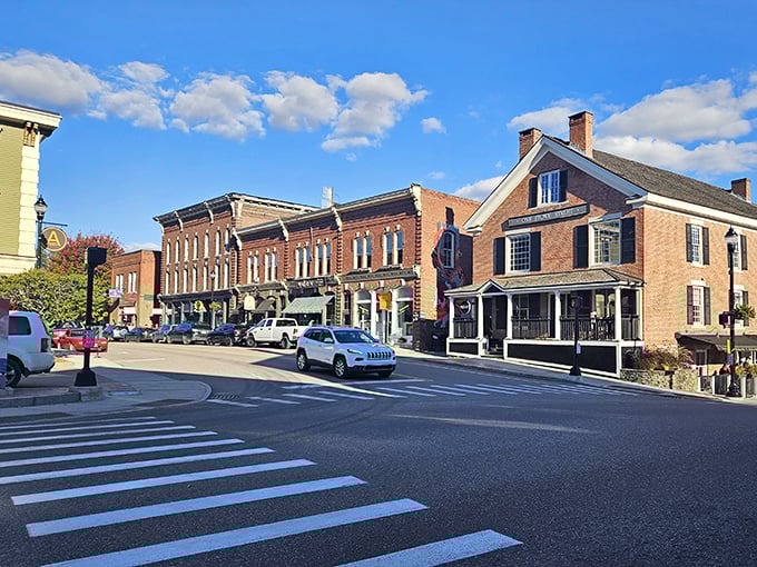 Sunlight bathes the historic district in golden warmth, highlighting the architectural details that have witnessed centuries of Vermont life.