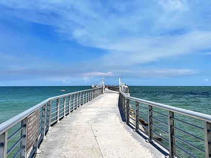 The fishing pier extends toward the horizon, a thin line between sky and sea where anglers gather with hopeful hearts.
