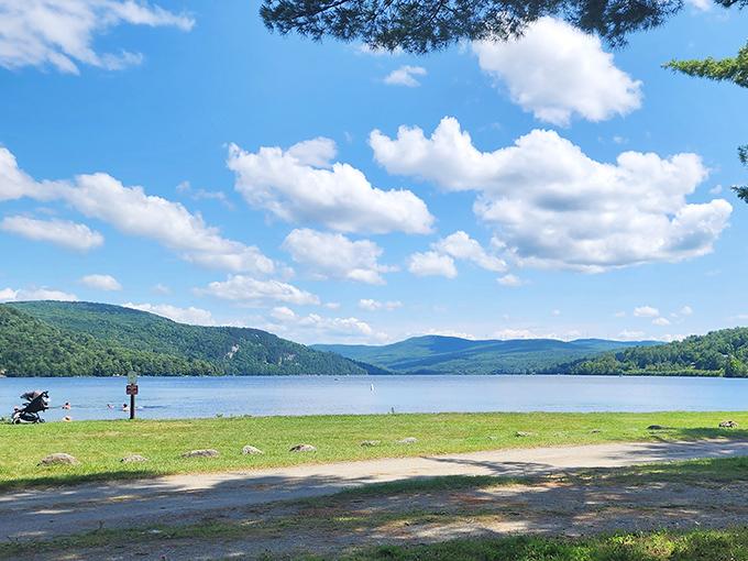 Nature's infinity pool: The unbroken horizon where Crystal Lake's clear waters merge with Vermont's green mountains.