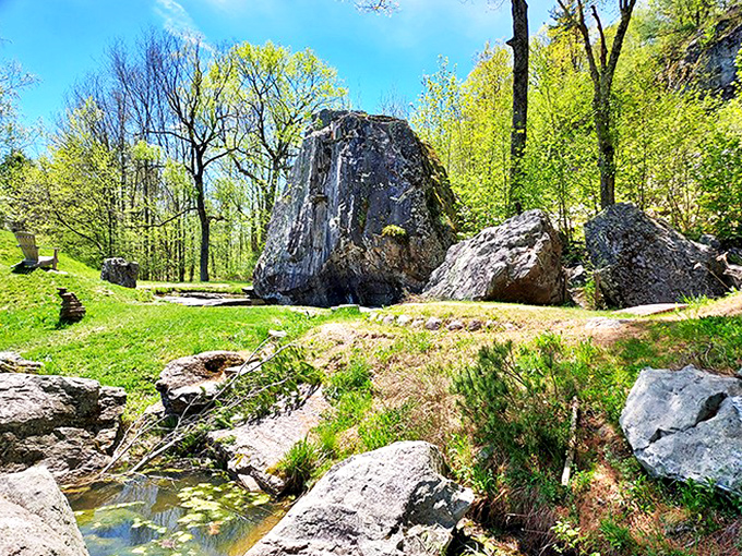 Massive ancient boulders create nature's sculpture garden, standing like silent sentinels that have witnessed centuries of Vermont's changing seasons.