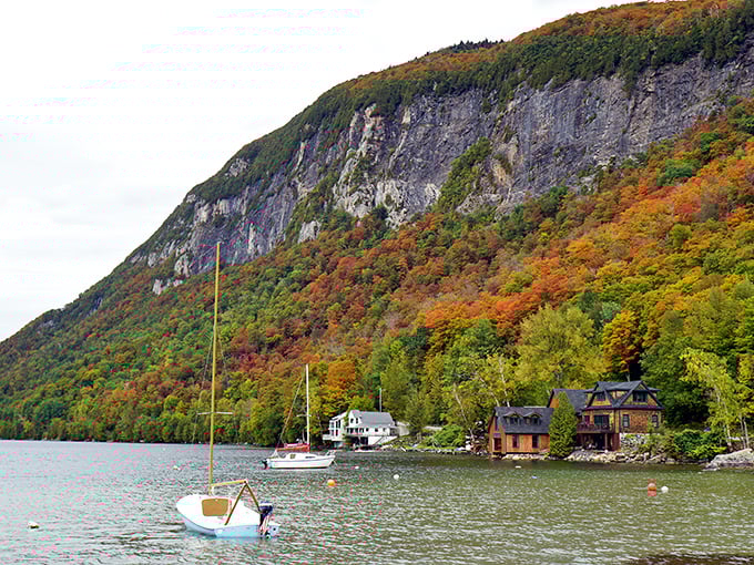 Fall foliage transforms the mountainsides into a painter's palette, with every warm hue imaginable cascading down to the water's edge.