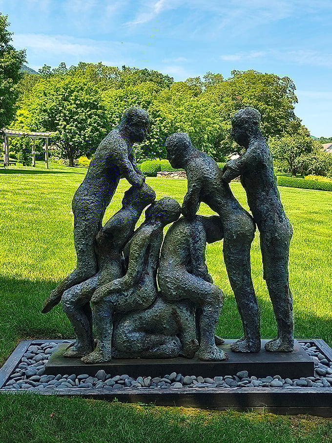 These bronze figures seem frozen mid-conversation, probably discussing whether they're art or just really well-dressed garden gnomes.