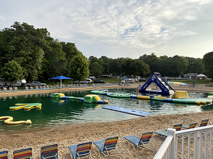 The inflatable water zone transforms an ordinary lake into an aquatic obstacle course where both kids and adults test their balance.