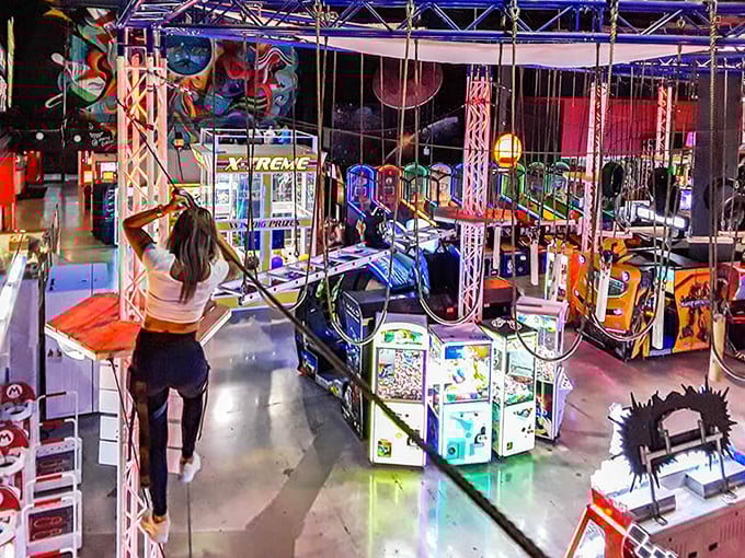 Suspended ziplines and neon-lit arcade games create a playground where gravity seems optional and fun is mandatory.