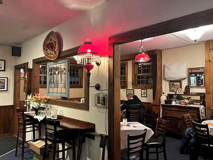 Inside, warm wood paneling and vintage red pendant lights create the kind of cozy atmosphere that makes you want to linger over coffee.