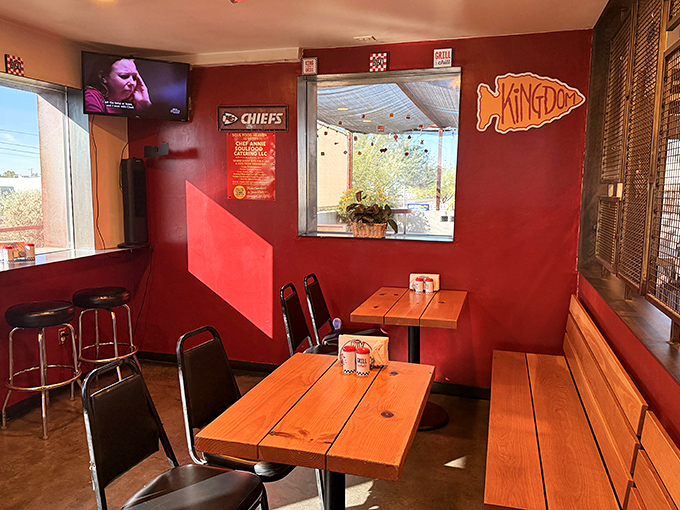 Red walls and simple wooden tables create an unpretentious atmosphere where the food, not the decor, takes center stage.