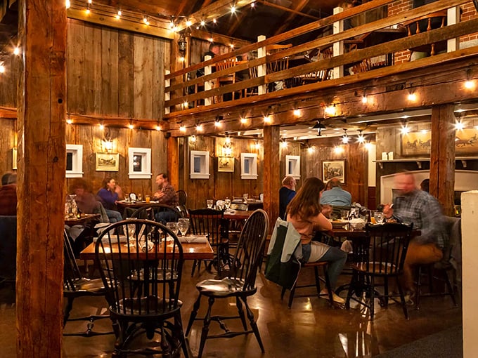String lights dance across original wooden beams in this converted 19th-century barn, creating a dining atmosphere that's equal parts historic and magical.
