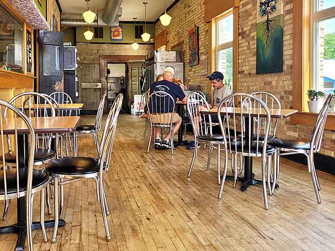 Exposed brick walls and vintage lighting create the perfect backdrop for memorable meals, while wooden floors whisper stories of banking days gone by.