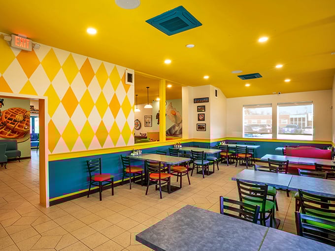 Sunshine yellow ceilings and diamond-patterned walls create a dining room that feels like stepping inside a happy daydream.