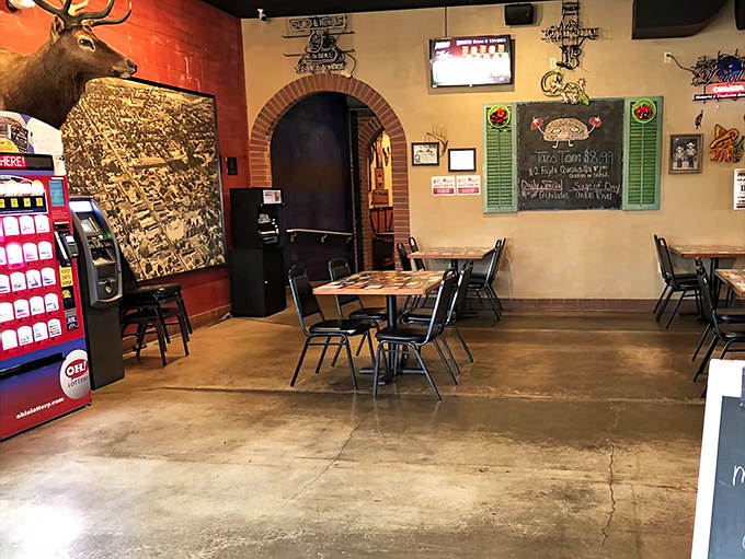 Mounted deer heads watch over diners while brick archways create cozy nooks perfect for savoring that legendary pulled pork.