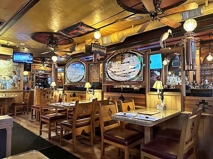 Rustic wooden charm meets cozy dining atmosphere inside Moosehead Saloon, where nautical touches and warm lighting create the perfect backdrop for serious eating.