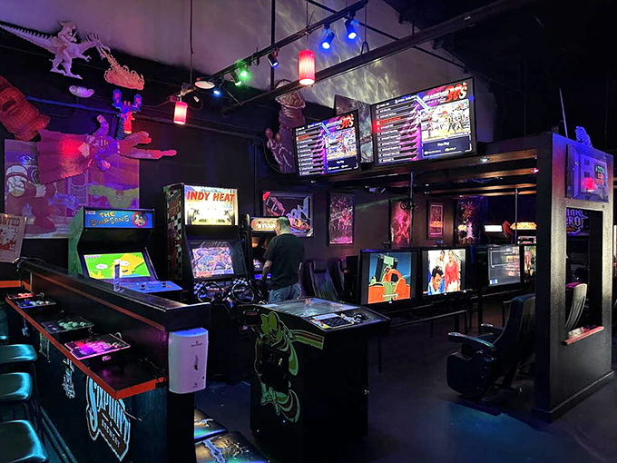 Classic arcade cabinets line the walls in this dimly lit gaming paradise, where every blinking light and electronic beep transports you back to simpler times.