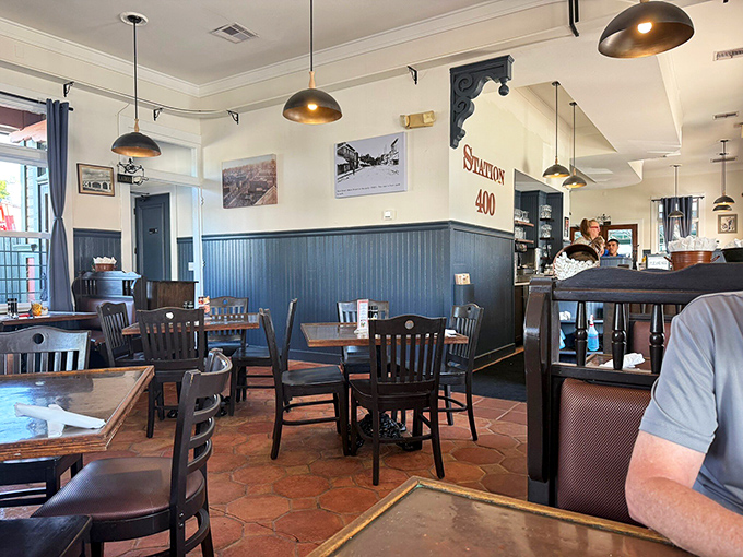 Cozy blue wainscoting meets warm wood tones in this breakfast sanctuary where every table feels like the best seat in the house.