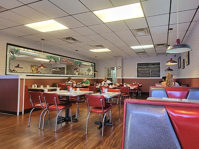 Classic diner vibes with red vinyl booths create the perfect backdrop for morning feasts and friendly conversation.