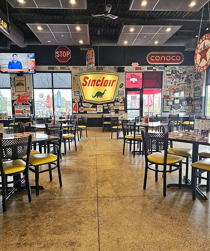 Step into a gearhead's dream dining room where vintage Sinclair dinosaurs roam among road signs and gas station memorabilia&mdash;comfort food meets classic Americana.